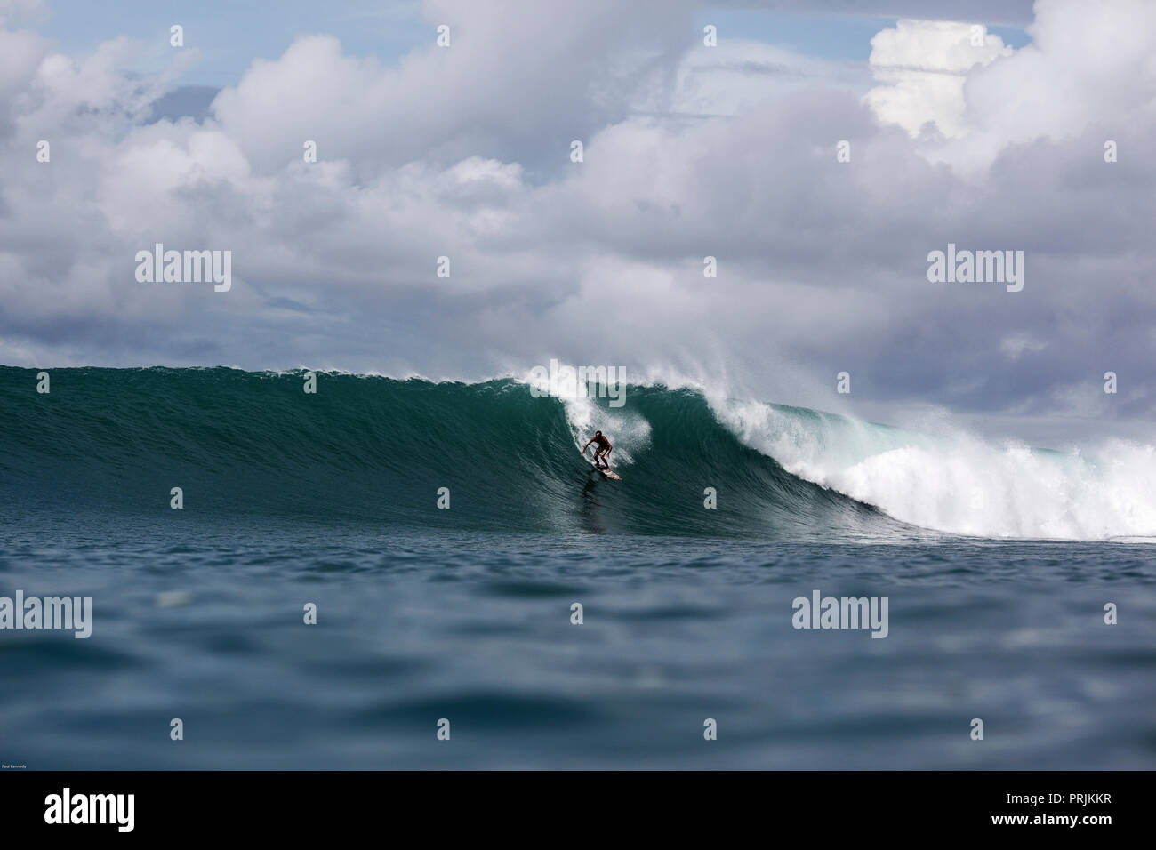 Surfing a big wave at Lagundri Bay on Nias Island, Sumatra, Indonesia ...