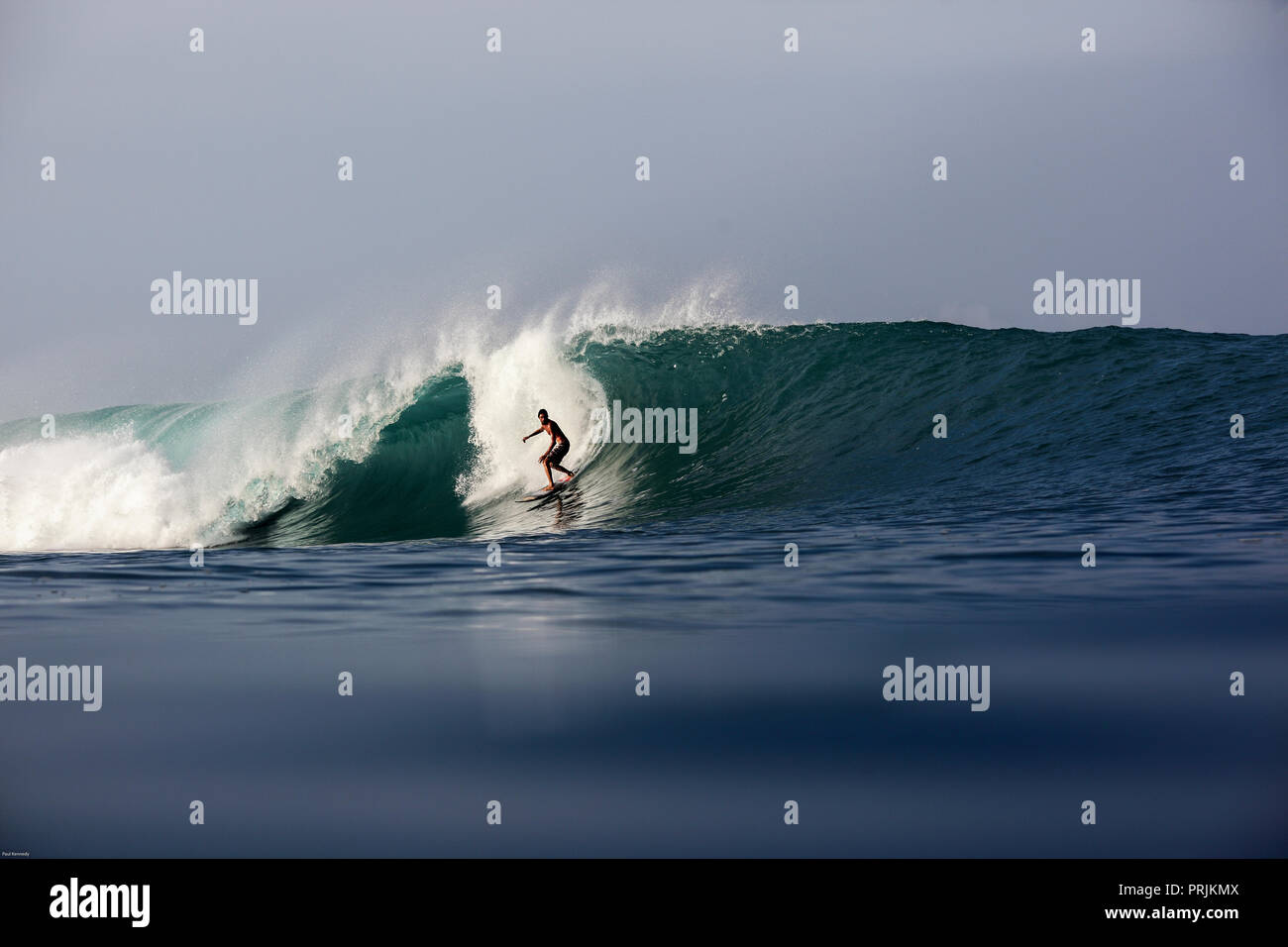 Surfing a big wave in Sumatra, Indonesia Stock Photo - Alamy