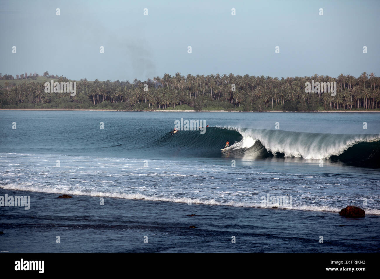 Surfing a big wave at Lagundri Bay on Nias Island, Sumatra, Indonesia ...