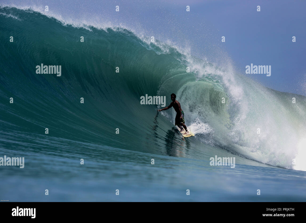 Local surfer riding big wave at Lagundri Bay, Nias, Sumatra Stock Photo ...