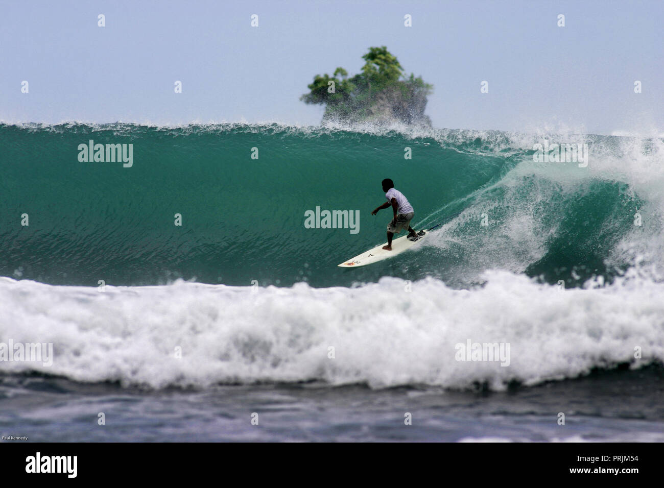 Local surfer riding big wave at Lagundri Bay, Nias, Sumatra Stock Photo ...