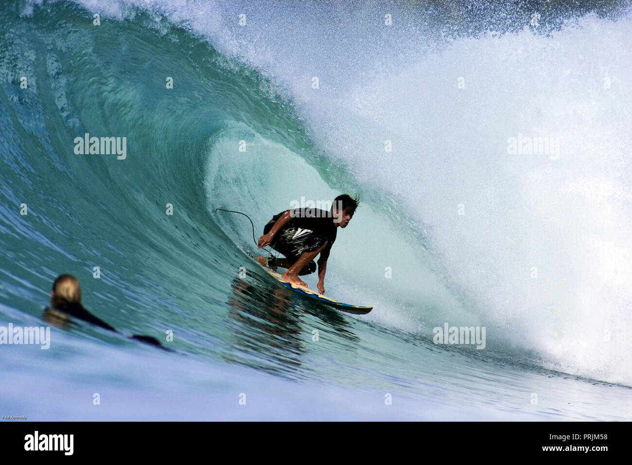 Local surfer riding big wave at Lagundri Bay, Nias, Sumatra Stock Photo ...