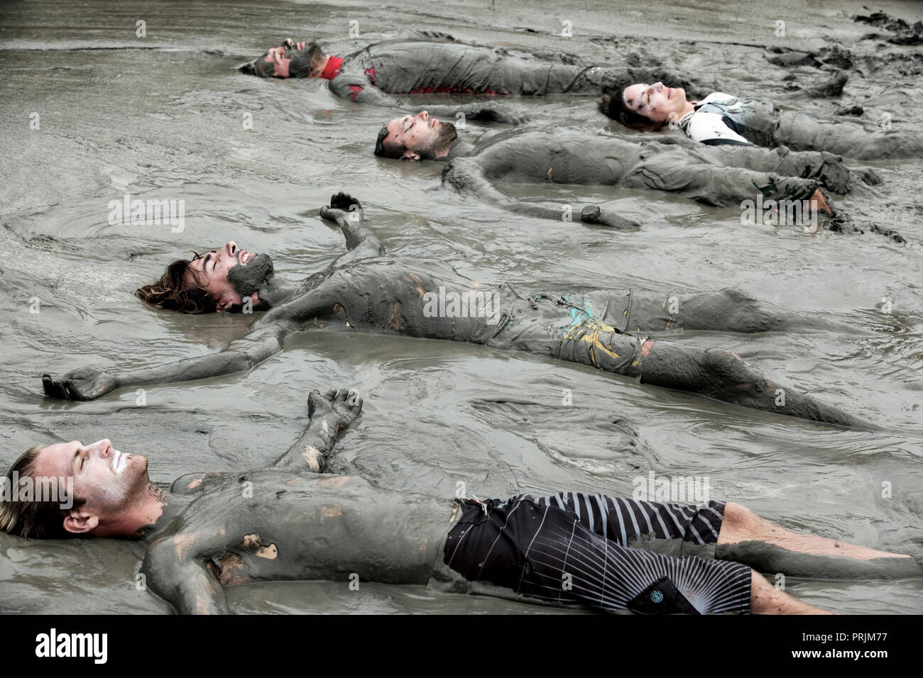 Young tourists relaxing in river mud on the Kampar River in Sumatra ...