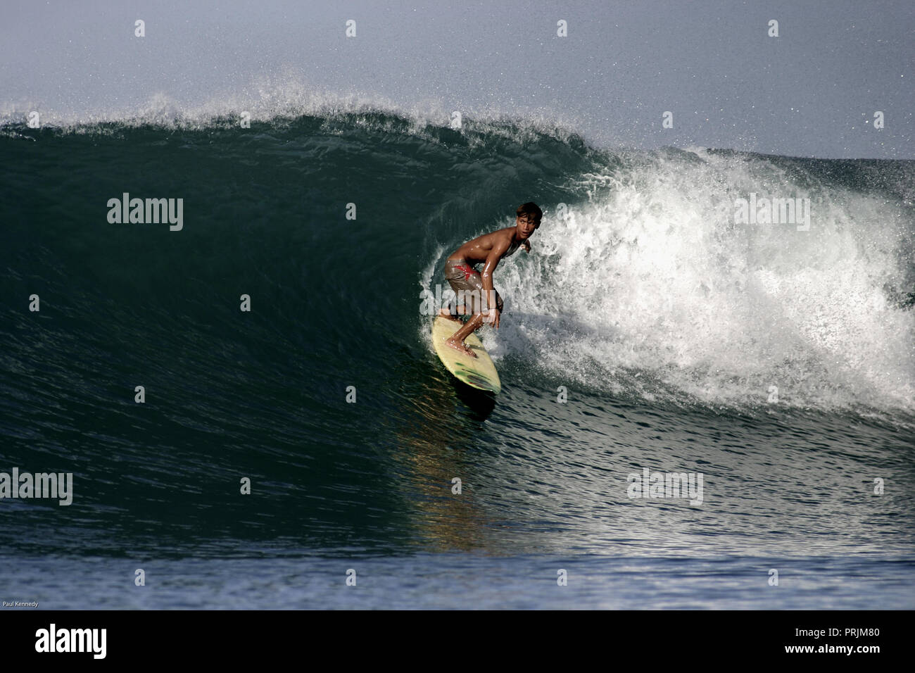 Local surfer riding big wave at Lagundri Bay, Nias, Sumatra Stock Photo ...