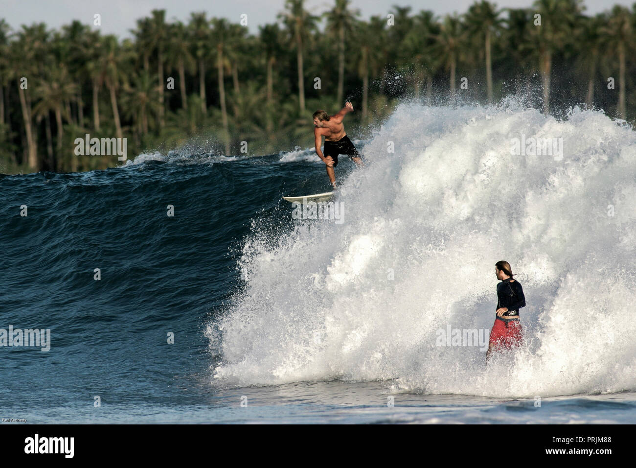 Surfing a big wave at Lagundri Bay on Nias Island, Sumatra, Indonesia ...