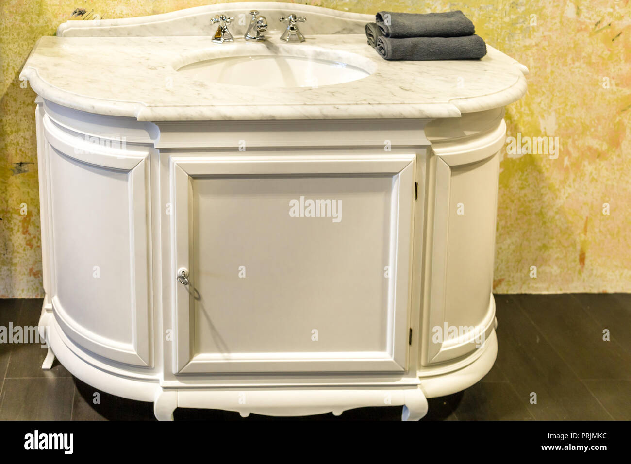 chrome faucets on marble counter Stock Photo - Alamy
