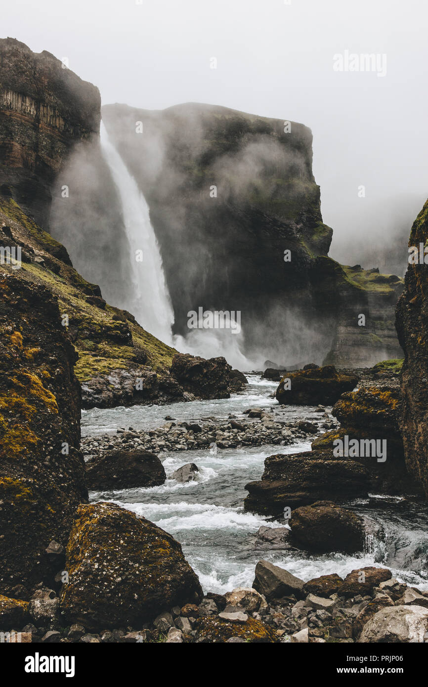dramatic icelandic landscape with Haifoss waterfall on misty day Stock ...