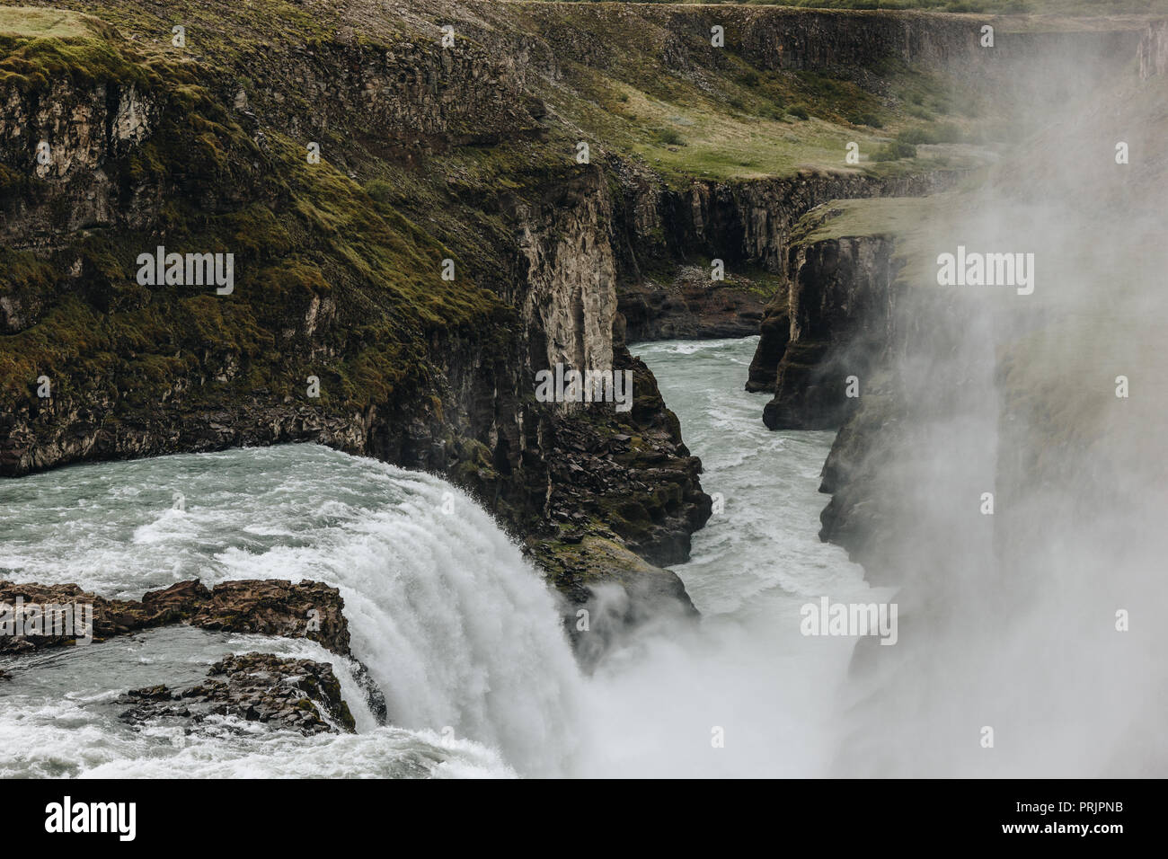 aerial view of beautiful Gullfoss waterfall flowing through highlands ...