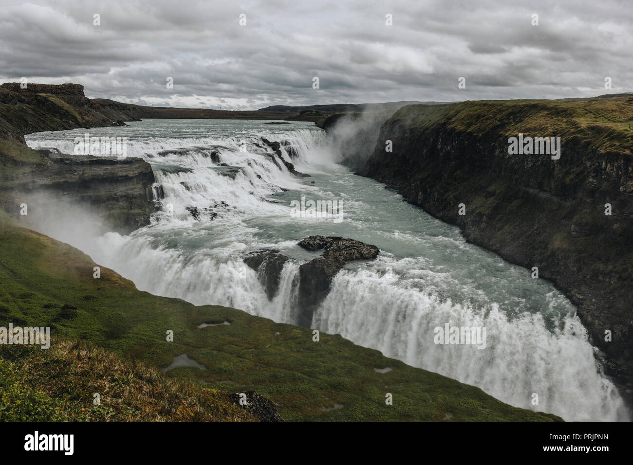 aerial view of beautiful Gullfoss waterfall flowing through highlands ...