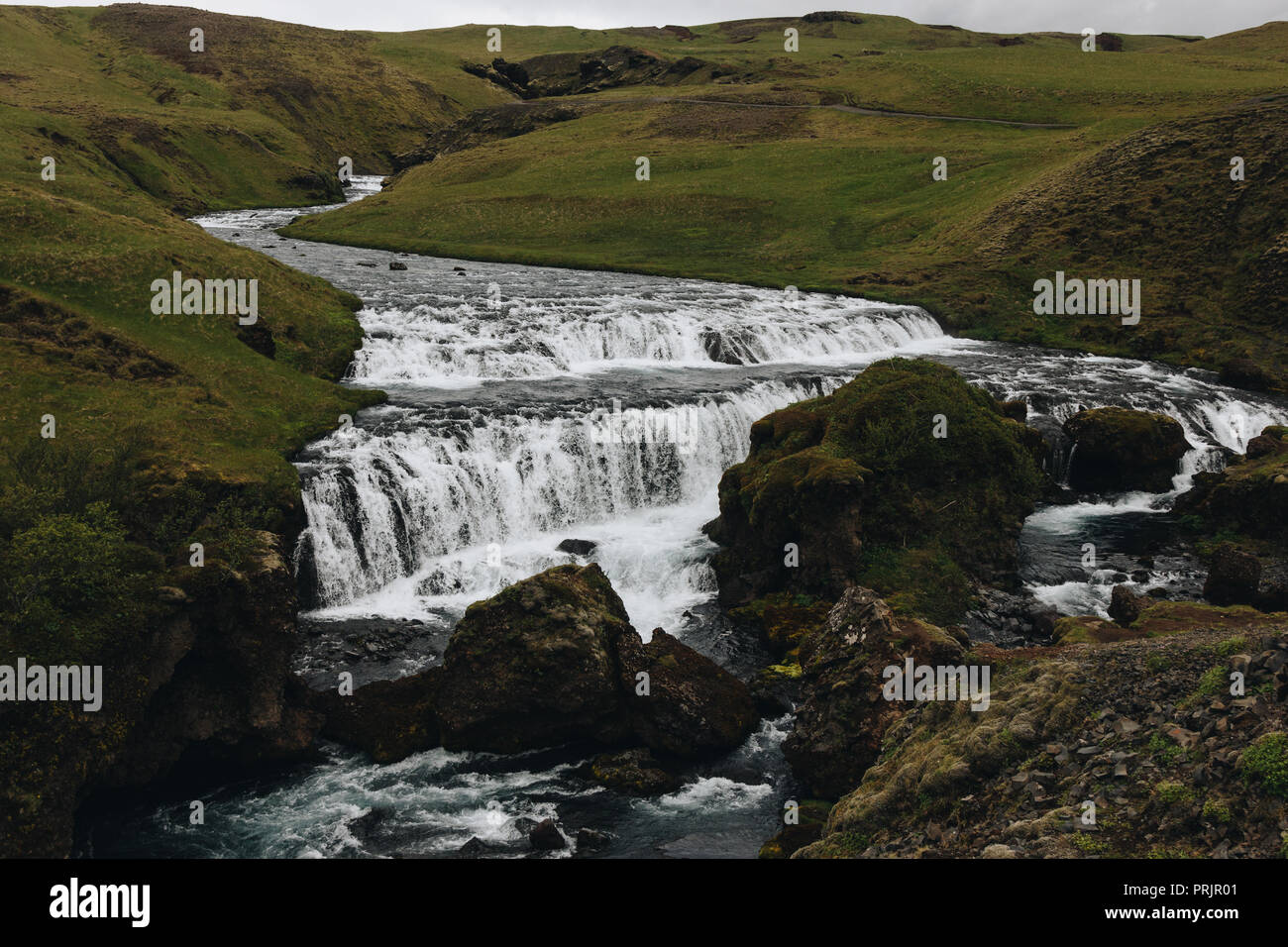scenic view of beautiful Skoga river flowing through highlands in ...