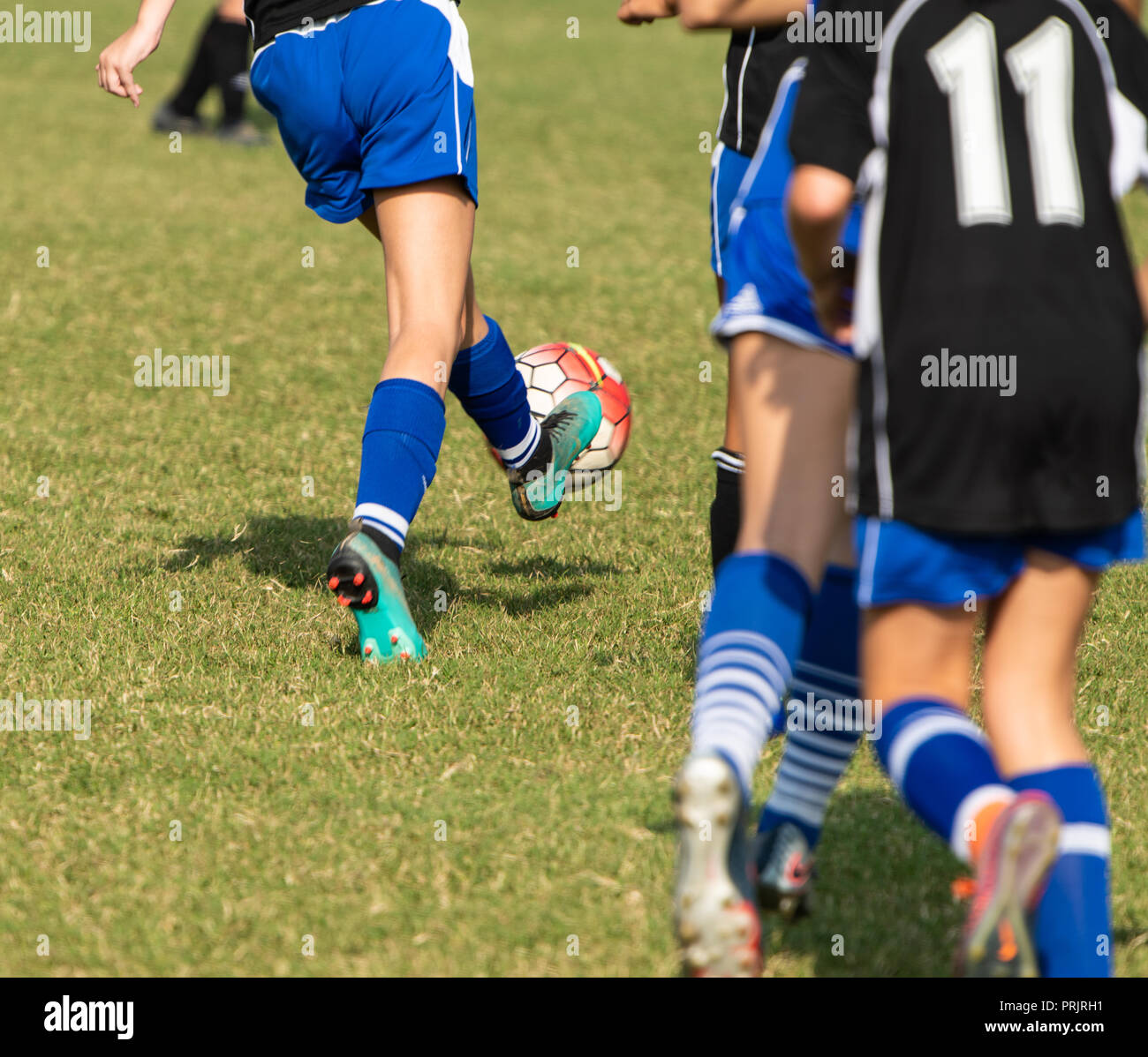 Close up action of youth girls soccer during a competitive match Stock ...
