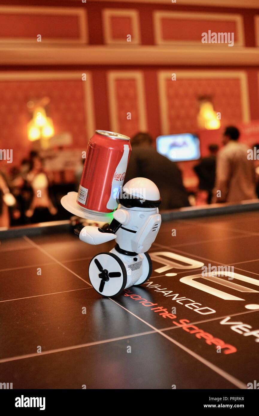 Small robot with Coca Cola on tray in demonstration, CES (Consumer ...