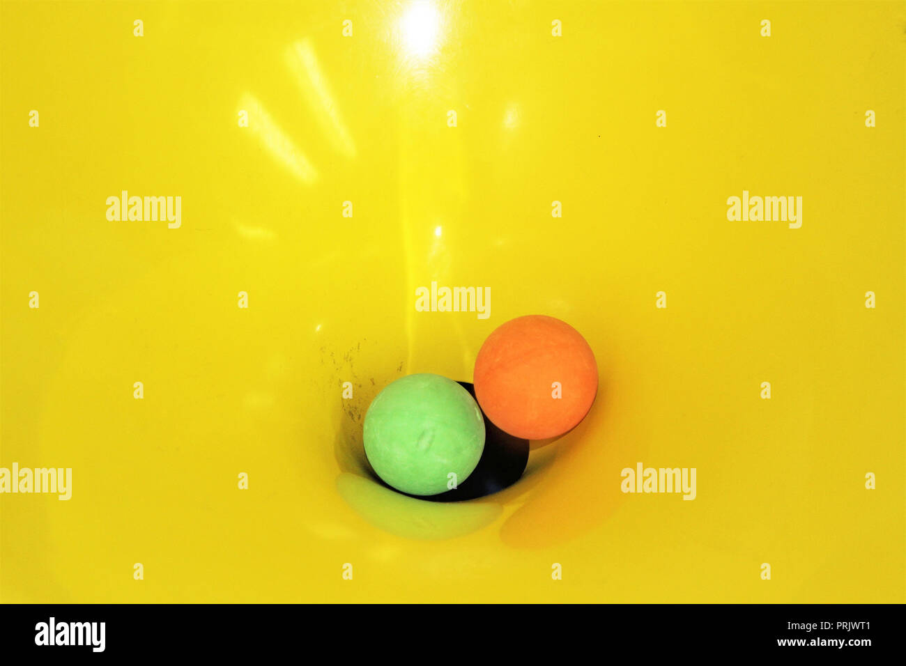 Rolling a ball into a vortex hole Stock Photo - Alamy