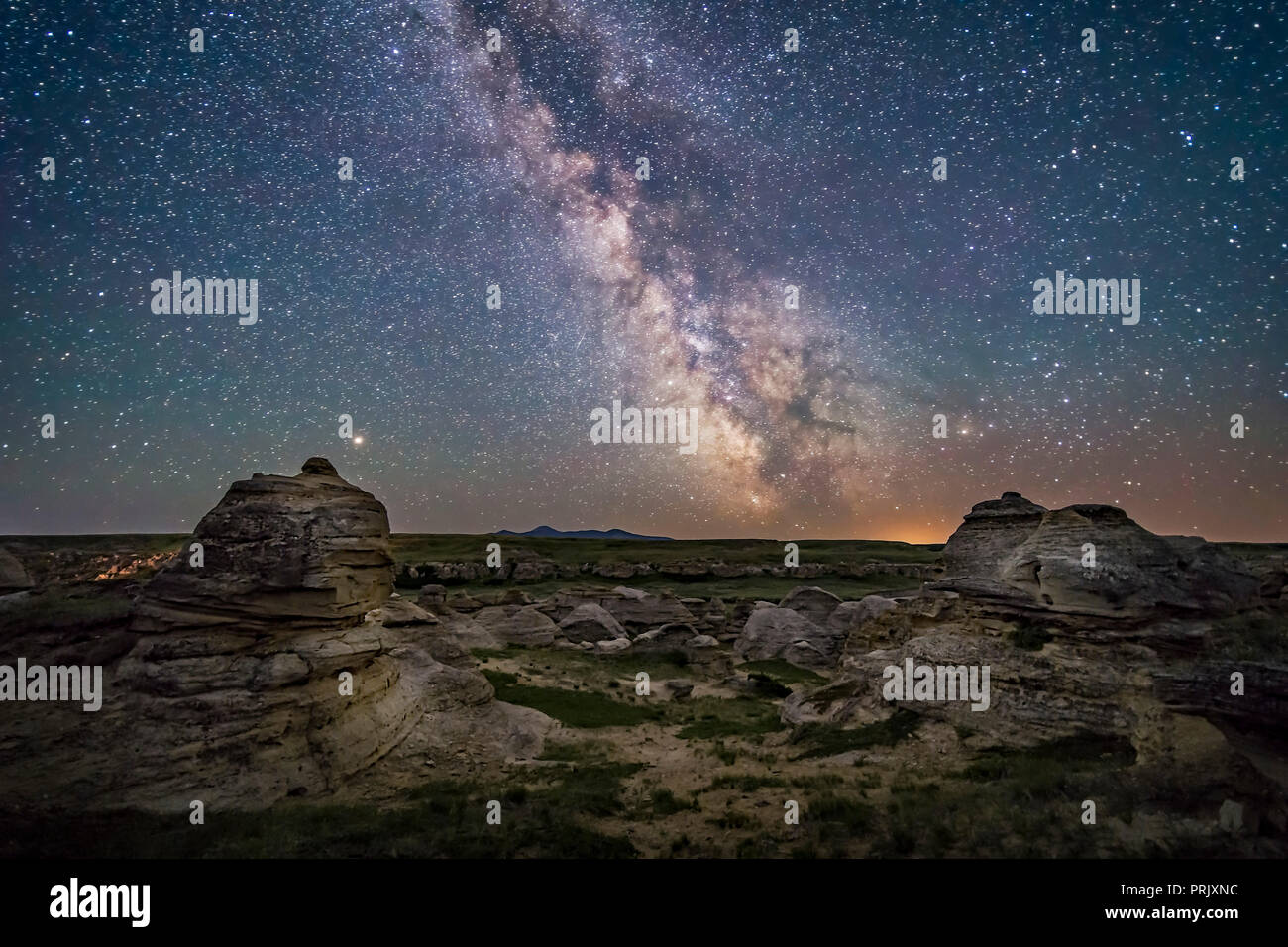 Mars (at left) and the galactic centre area of the summer Milky Way low ...