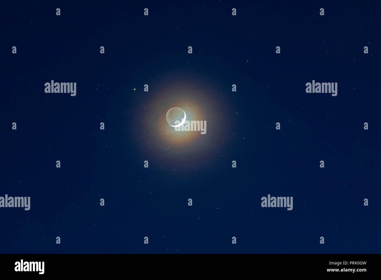 The waxing crescent Moon in the Hyades star cluster and below reddish ...