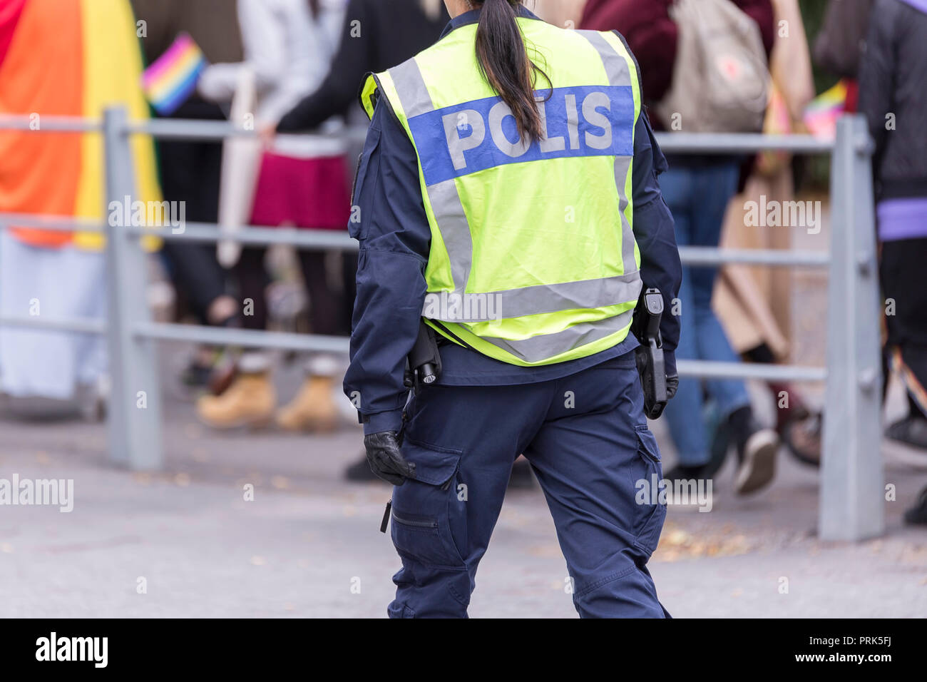 Swedish Police Officer with Reflective Vest and gun Stock Photo - Alamy
