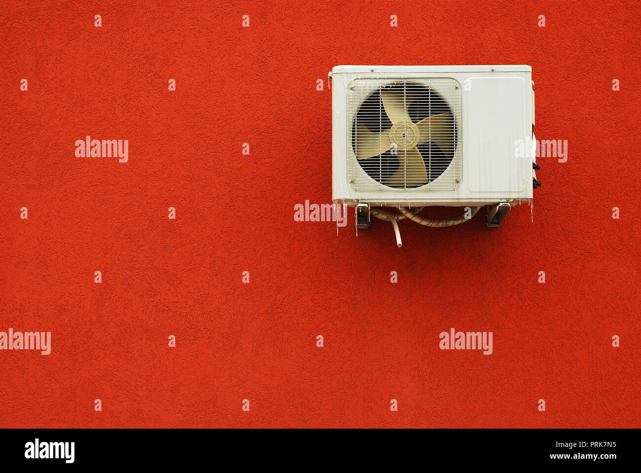 air conditioner over a red wall Stock Photo - Alamy
