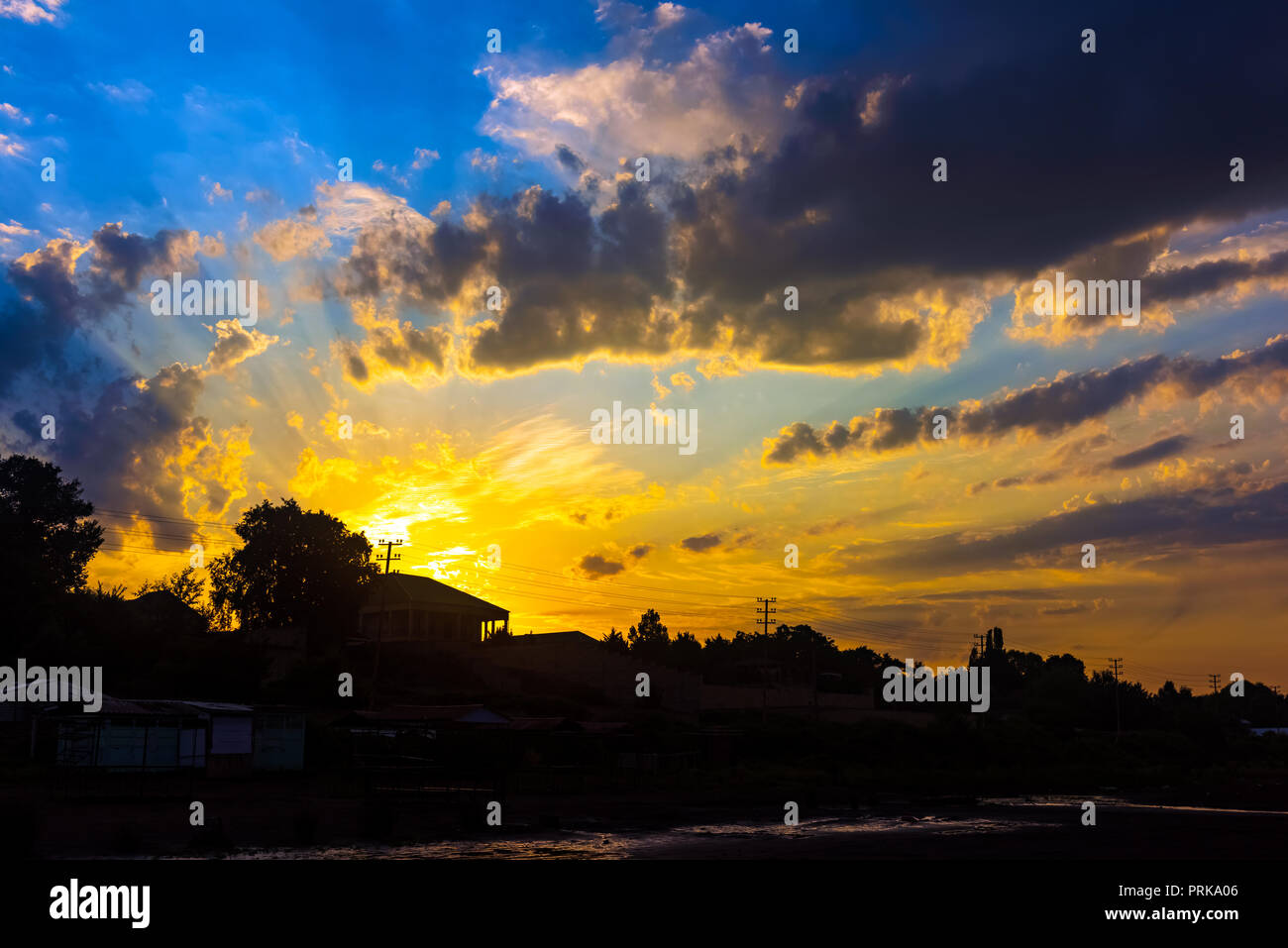 Amazing beautiful sunset sky over the village, atmospheric mood Stock ...
