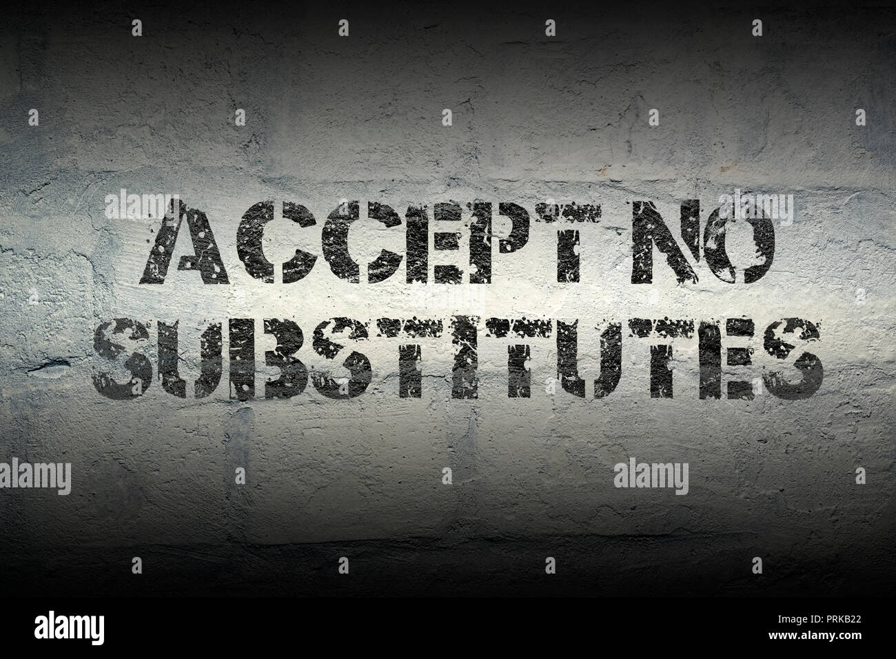 accept no substitutes stencil print on the grunge white brick wall ...
