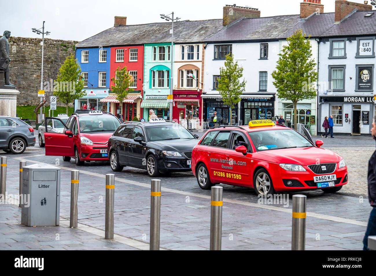 CAERNARFON / WALES - MAY 01 2018 : Taxis on a windy day Stock Photo - Alamy