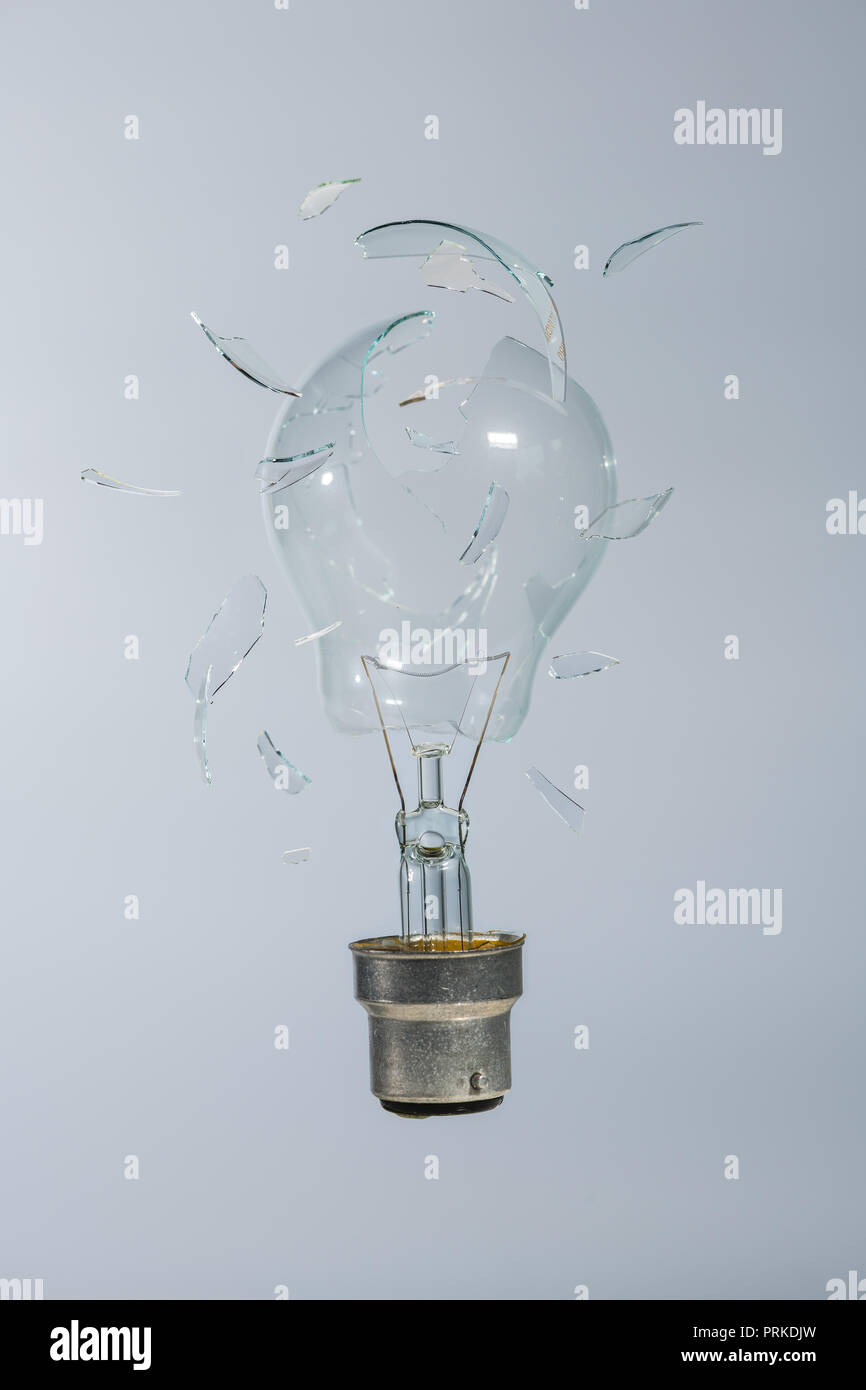 The electric light buld shattered into pieces in mid air Stock Photo ...