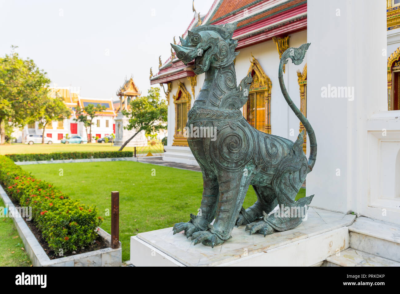 Singha or the lion statue in front of Thai temple represent the ...
