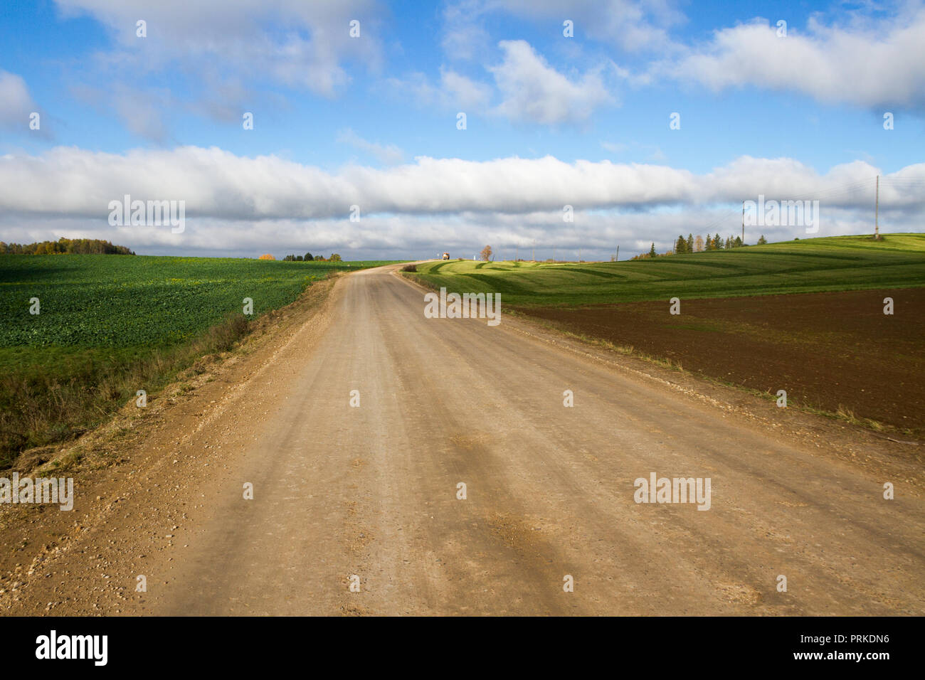 Country landscape with gravel road Stock Photo - Alamy