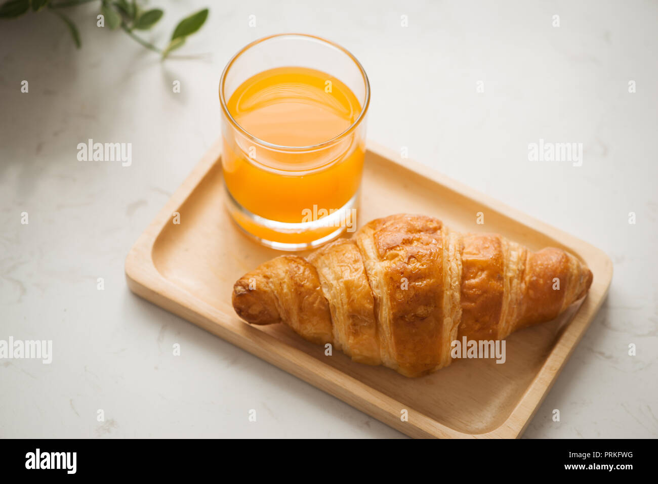 Morning breakfast with croissant and fruit juice Stock Photo - Alamy