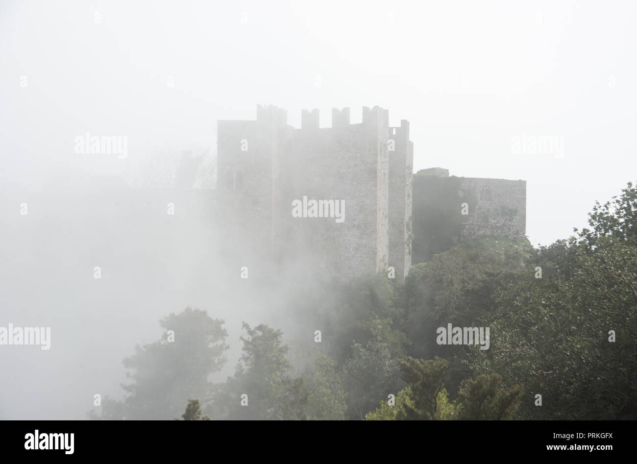 Beautiful medieval castle on a hilltop half covered with cloud Stock ...