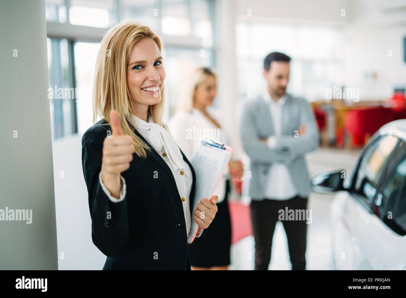 Picture of attractive saleswoman working in company Stock Photo - Alamy