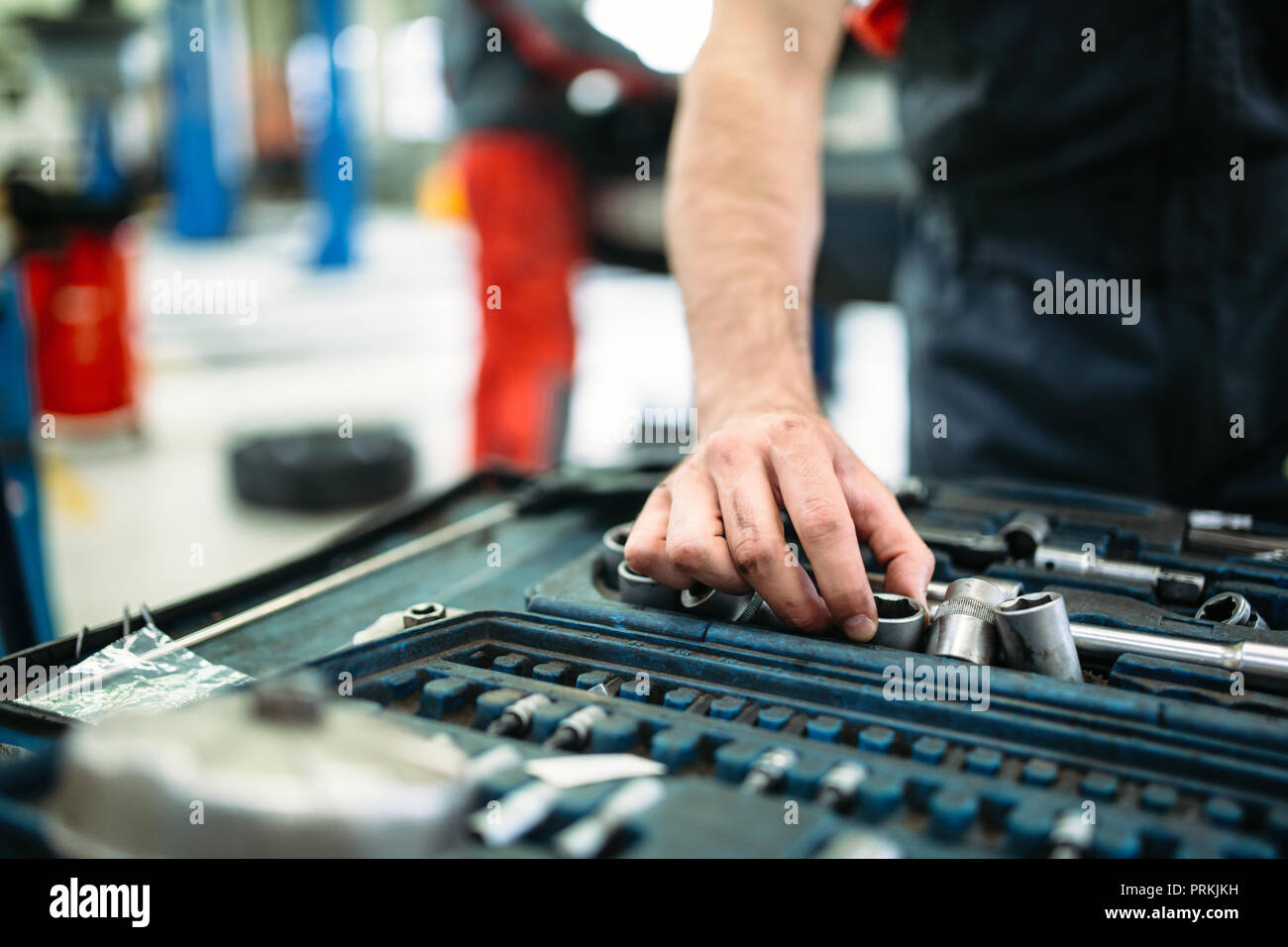 Auto mechanic working in garage. Repair service Stock Photo - Alamy