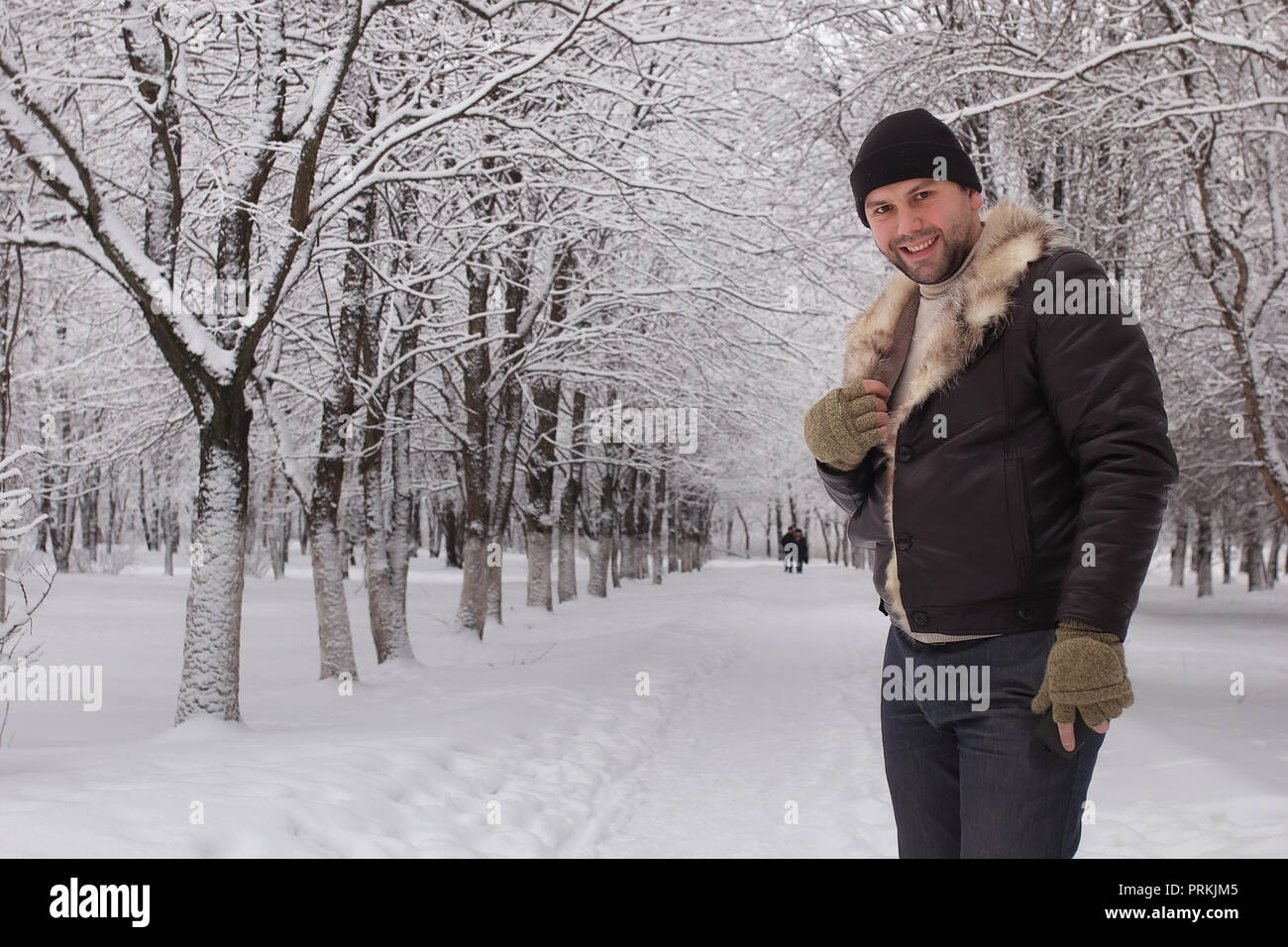 bearded man walking in a winter park Stock Photo - Alamy