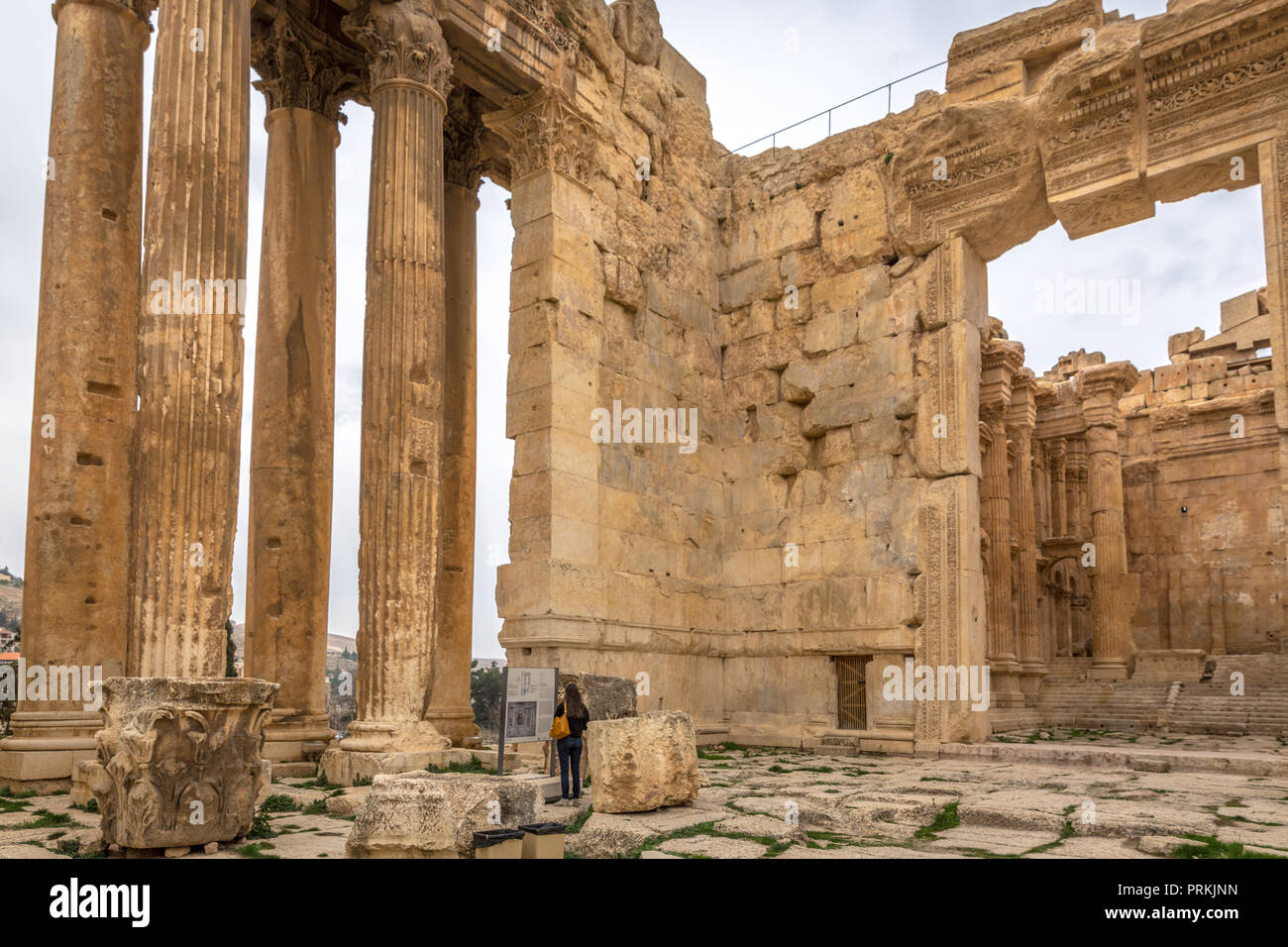 Tourist enjoying the amazing view of the rome ruins of Balbek in ...
