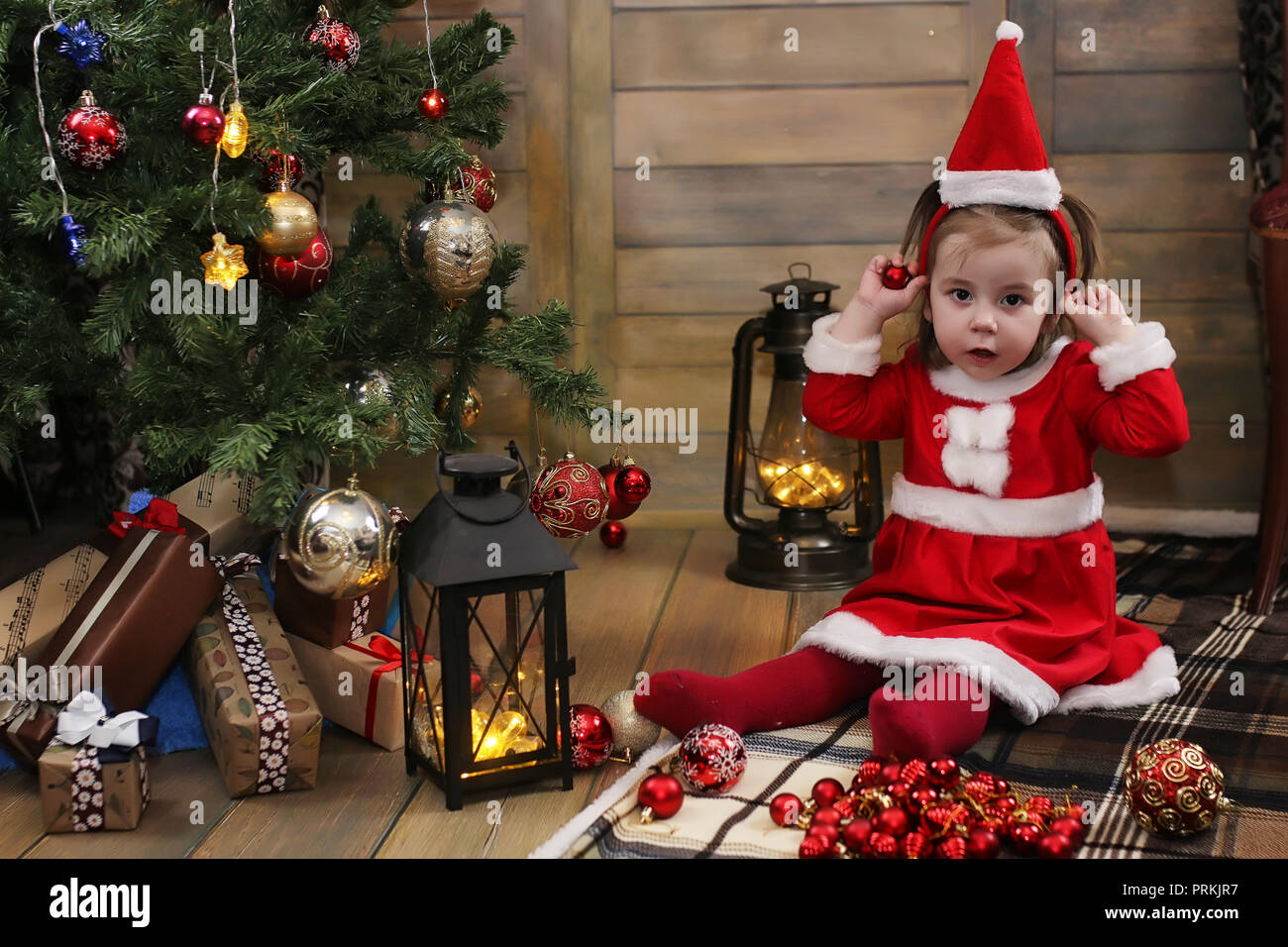 little child and Christmas toys Stock Photo - Alamy