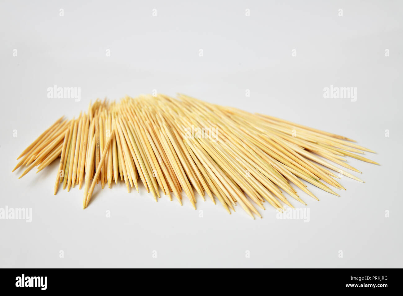 Heap of toothpicks on a white background Stock Photo - Alamy