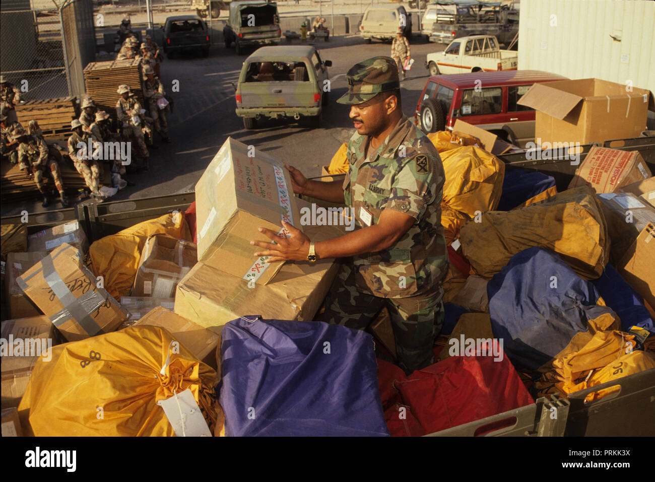 A soldier works with mail coming to the troops in the preparations for ...