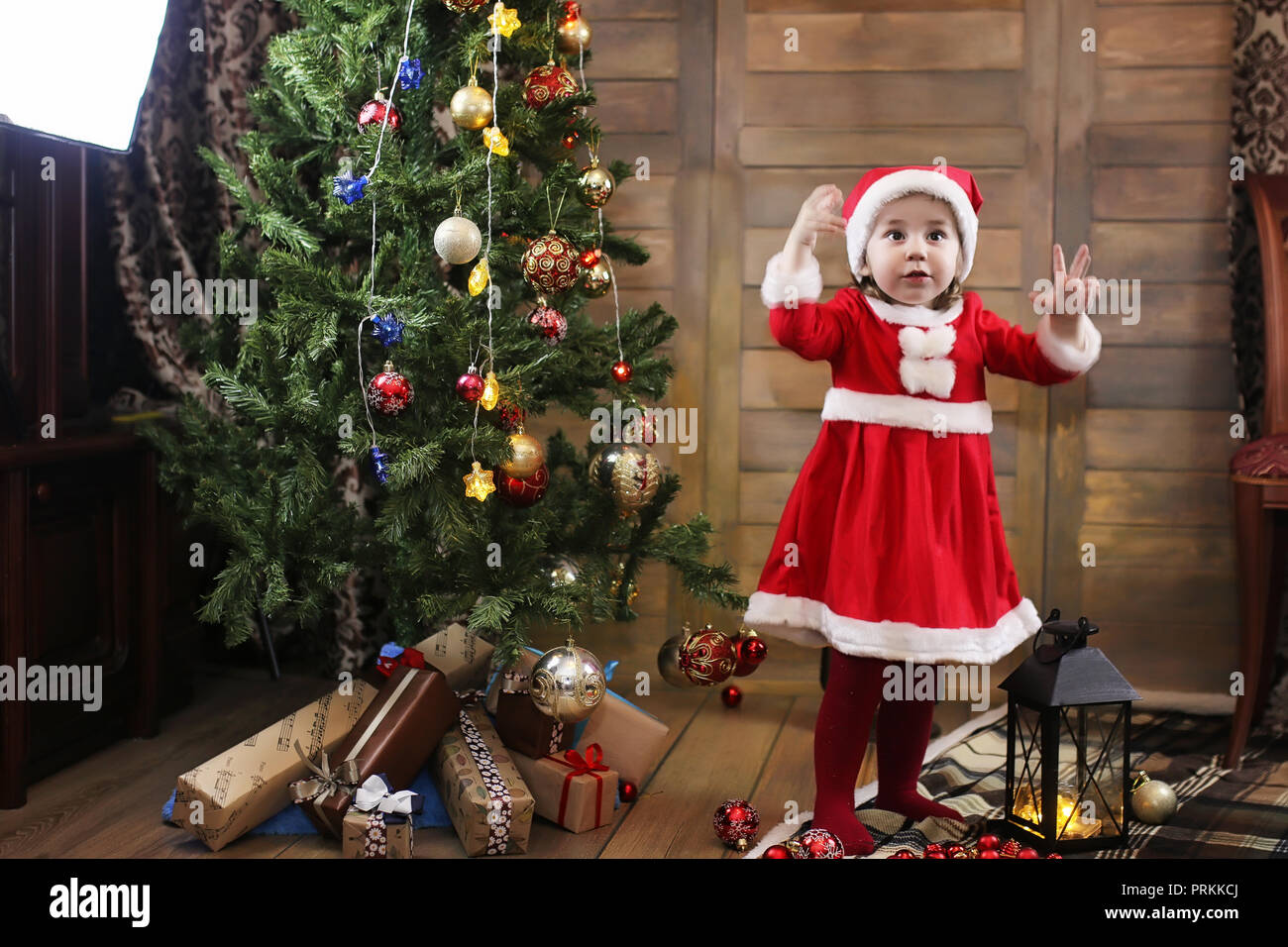 little child and Christmas toys Stock Photo - Alamy