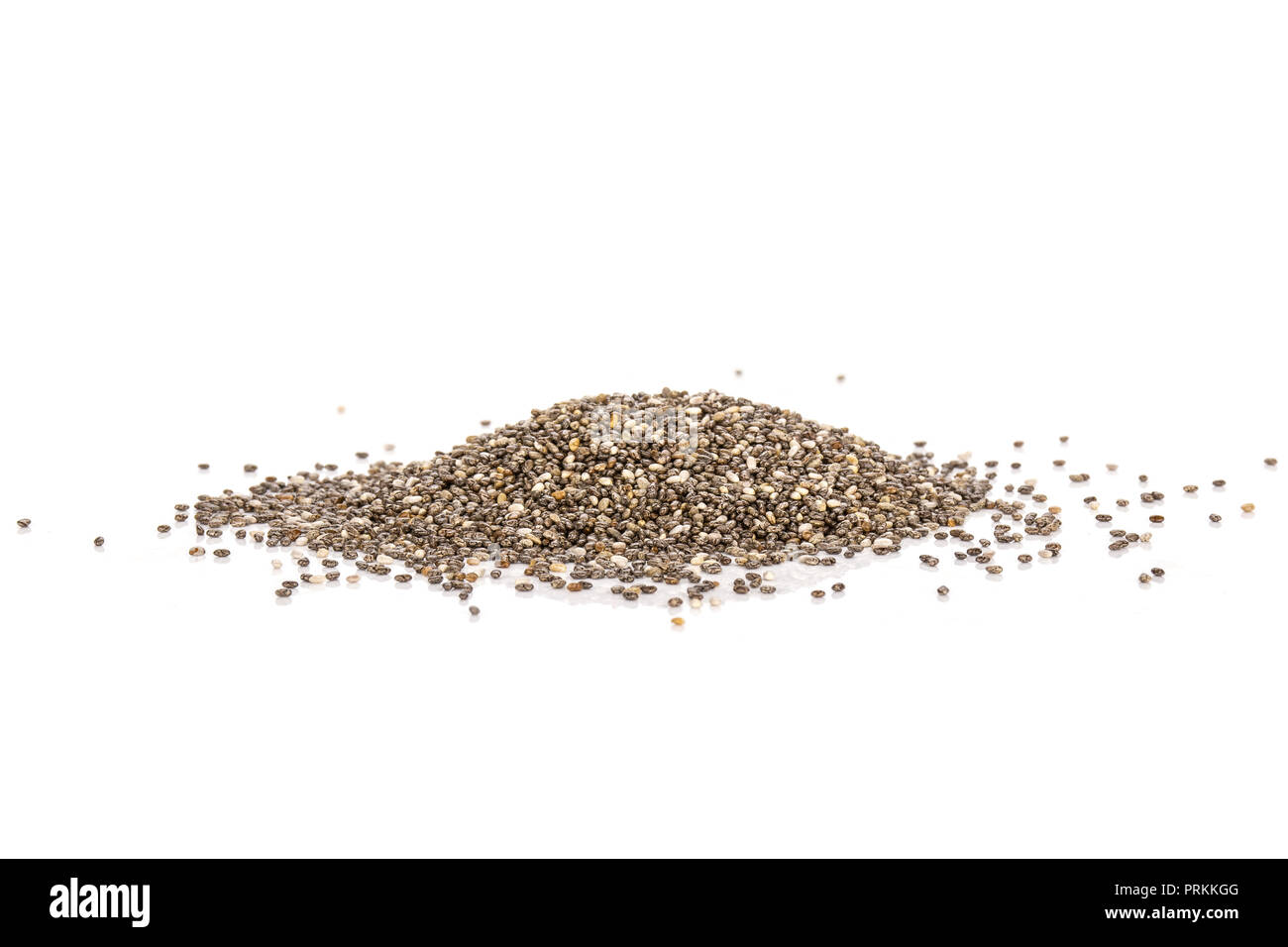 Lot of whole fresh mottled chia seeds isolated on white background ...