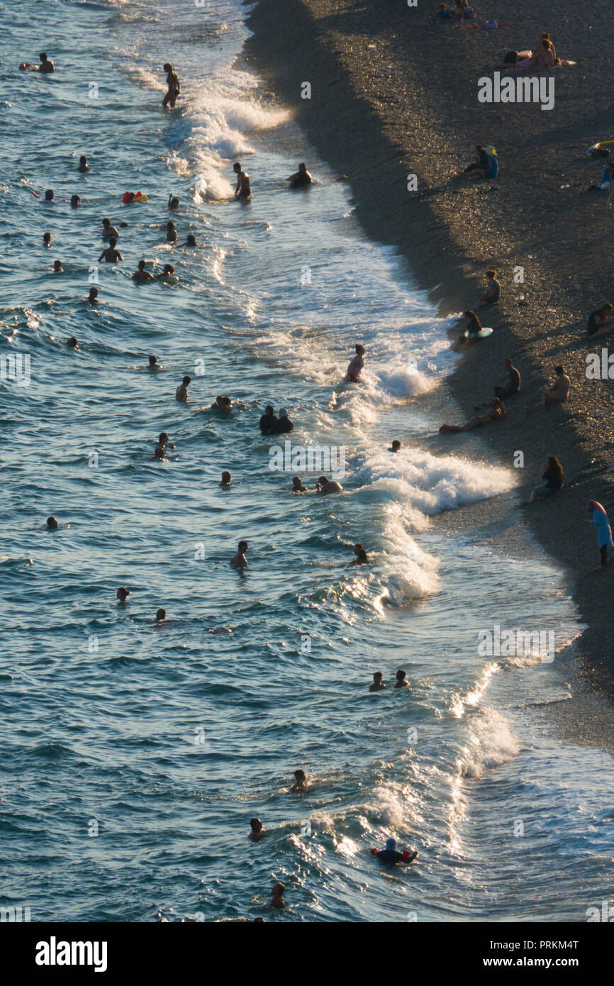 People swimming and sunbathing at beach in Antalya, Turkey Stock Photo ...