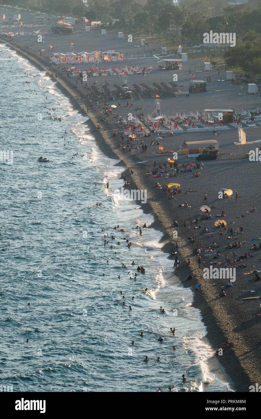 People swimming and sunbathing at beach in Antalya, Turkey Stock Photo ...