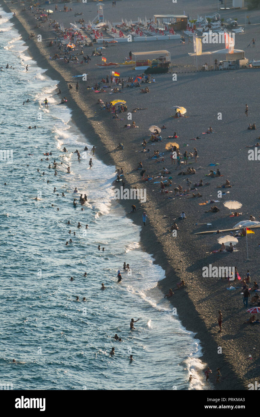 People swimming and sunbathing at beach in Antalya, Turkey Stock Photo ...
