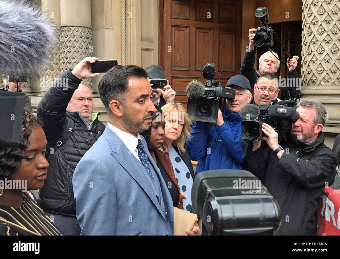 Members of Sheku Bayoh's family, along with their lawyer Aamer Anwar ...