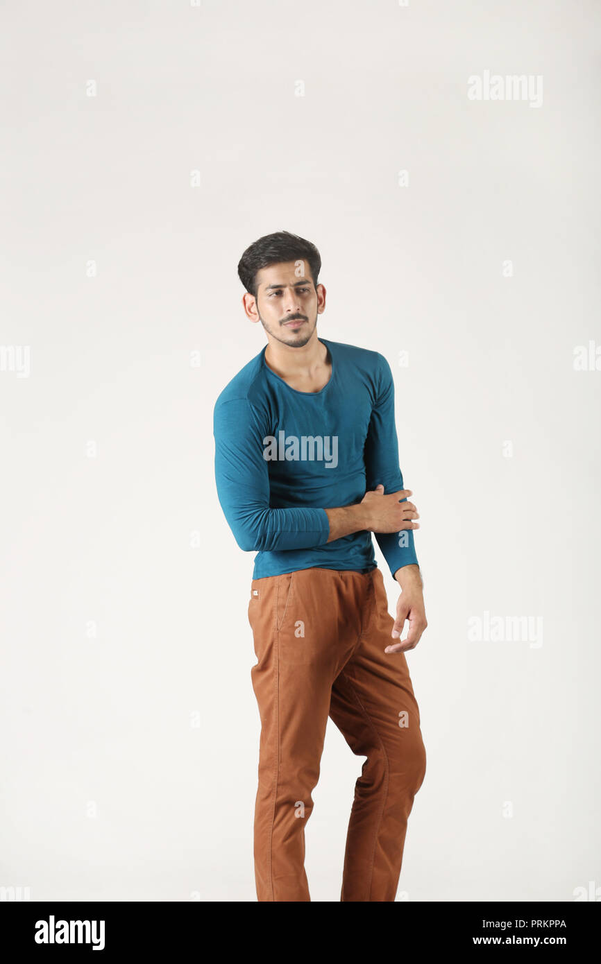 Standing boy on the floor on white background Stock Photo - Alamy