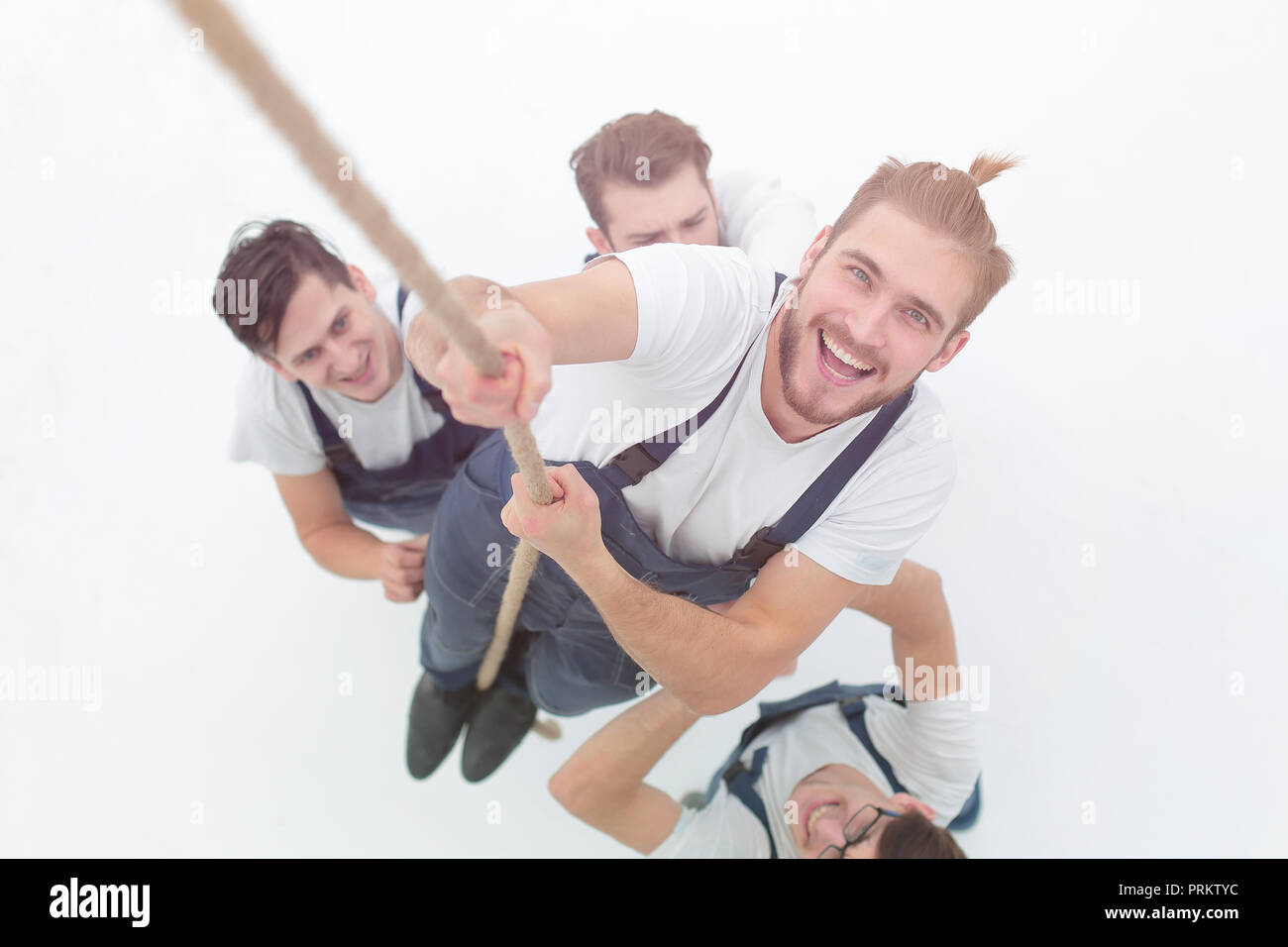 view from the top.smiling engineer ,climbing up the rope Stock Photo ...