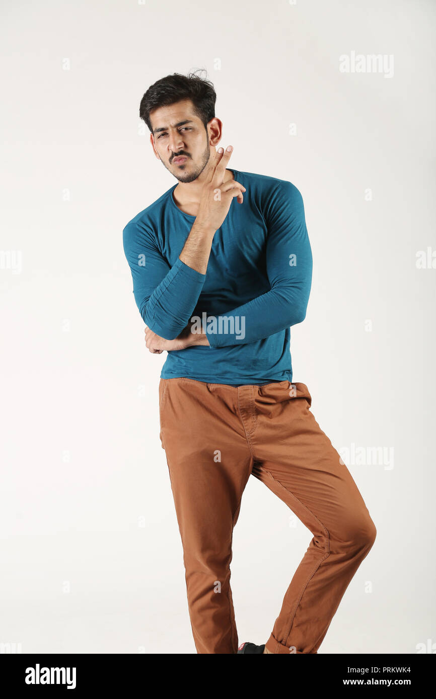 Boy is standing in stylish on the floor. Isolated on white background ...