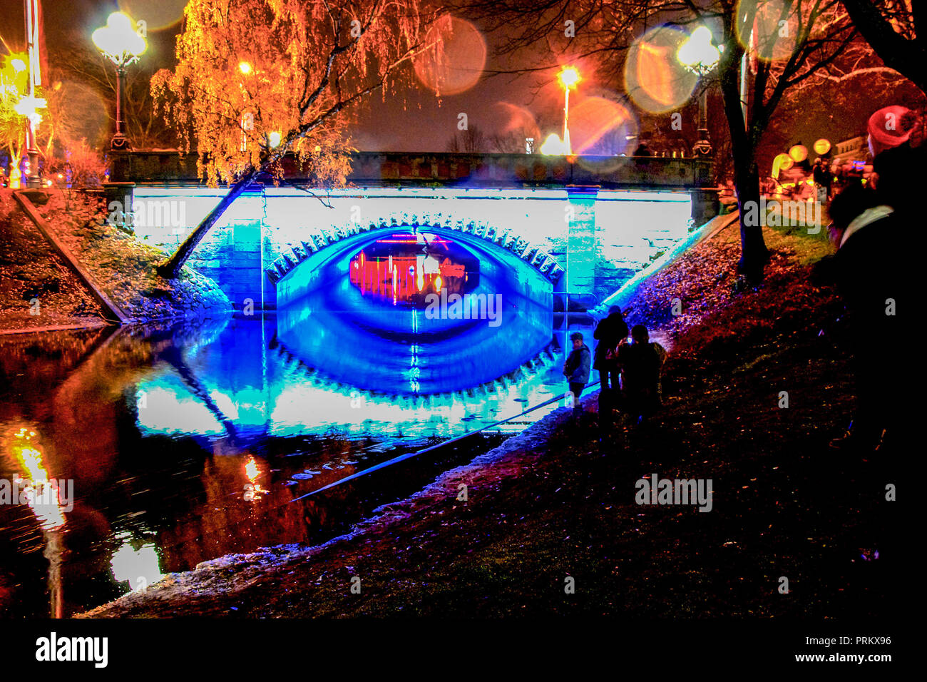 Illuminated bridge at light festival Staro Riga in Latvia Stock Photo ...