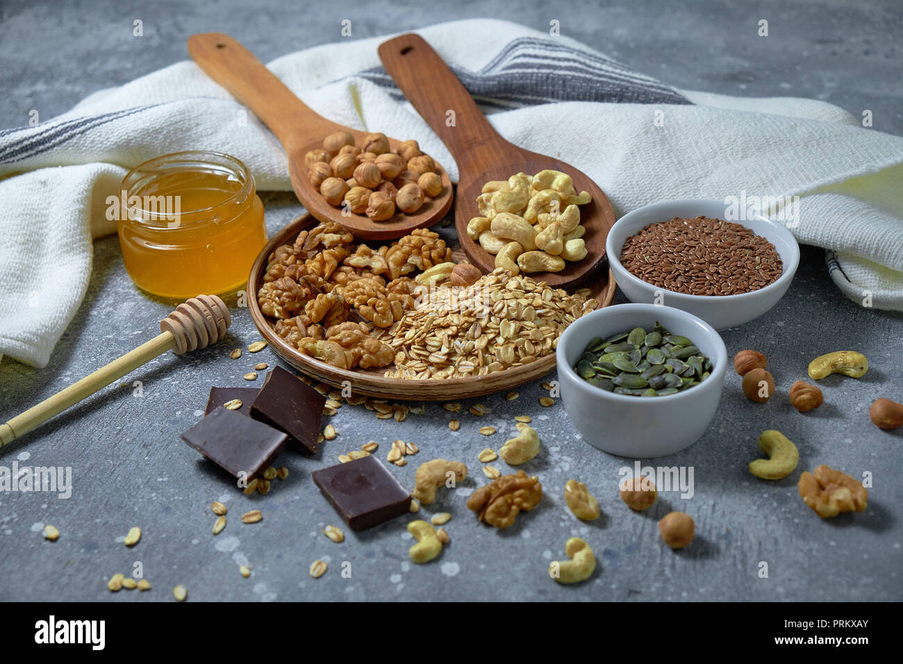 Various nuts on stone table. Top view with copy space Stock Photo - Alamy