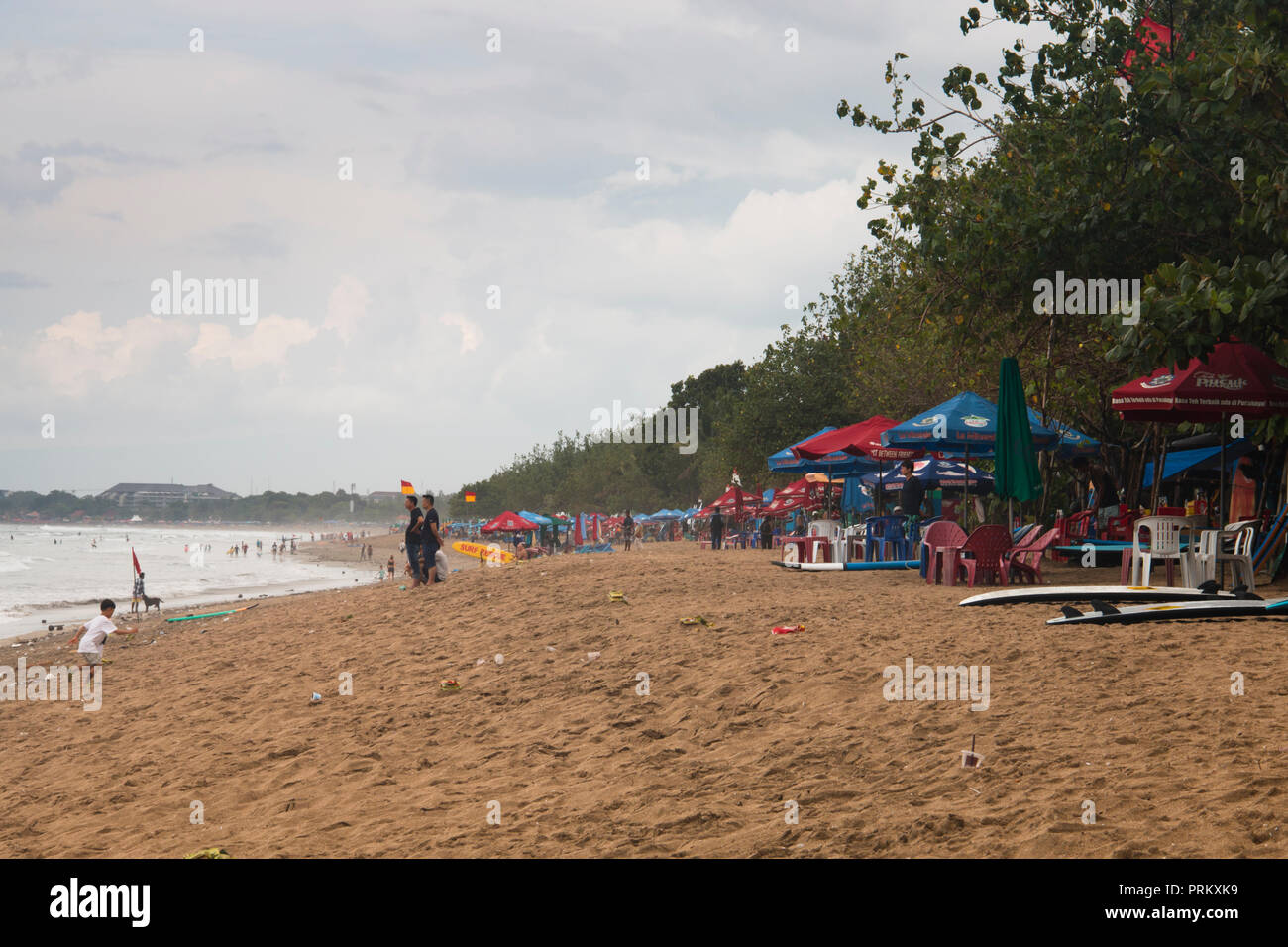KUTA, BALI - JANUARY 2018: People and lots of garbage on Kuta beach in ...