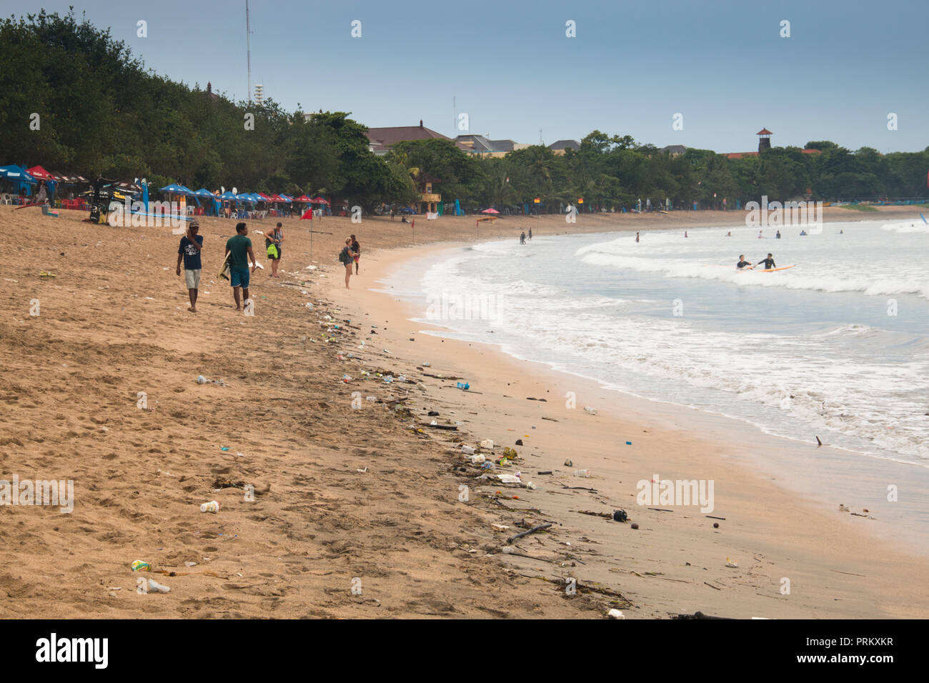 KUTA, BALI - JANUARY 2018: People and lots of garbage on Kuta beach in ...