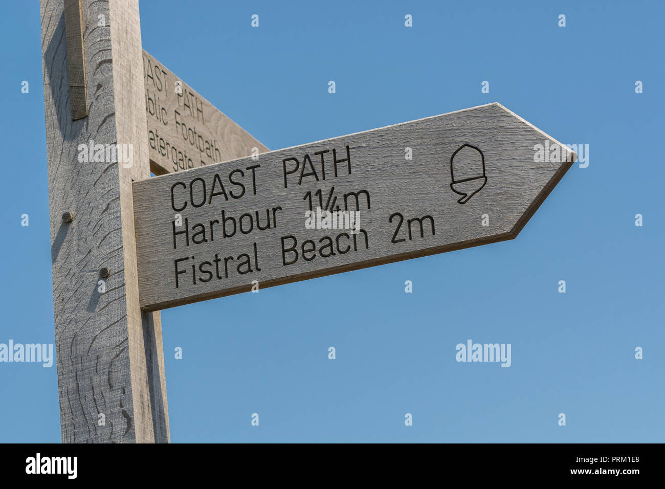 Wooden sign pointing to Fistral Beach, Newquay Harbour and route of the ...